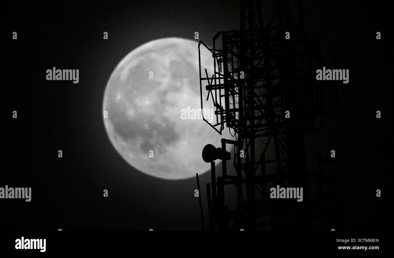 Brighton UK 7th October 2025 - The Harvest Moon rises behind the ...