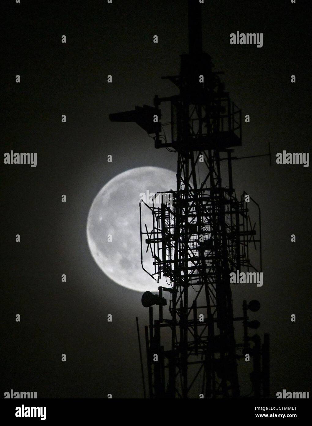 Brighton UK 7th October 2025 - The Harvest Moon rises behind the ...