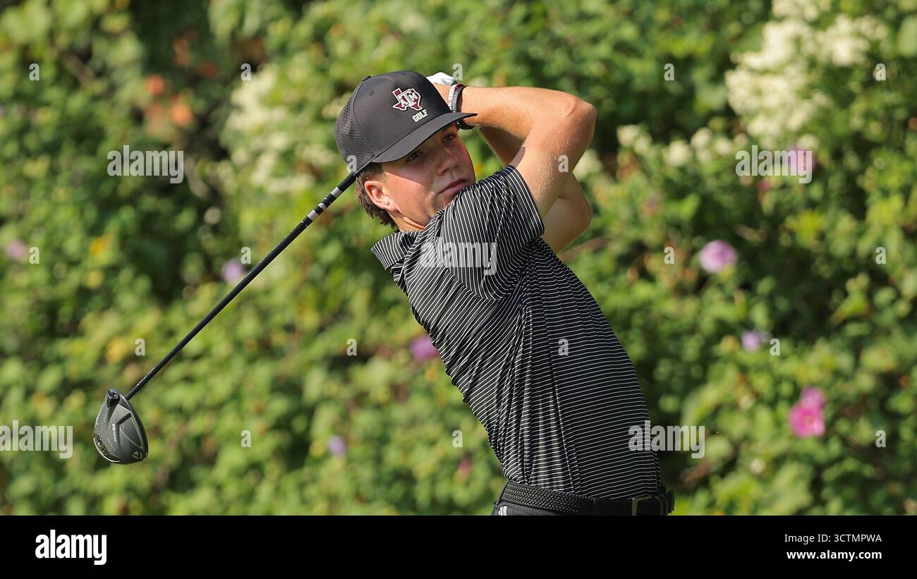 Wheaton Ennis, of Texas A&M, tees off from hole one during an NCAA golf ...