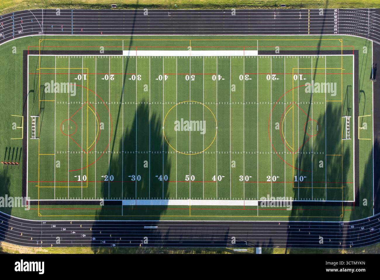 Aerial view of American football field in stadium with full sunlight ...