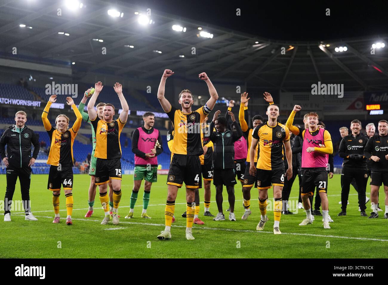 Newport County's Matthew Baker (centre) and team-mates celebrate after ...