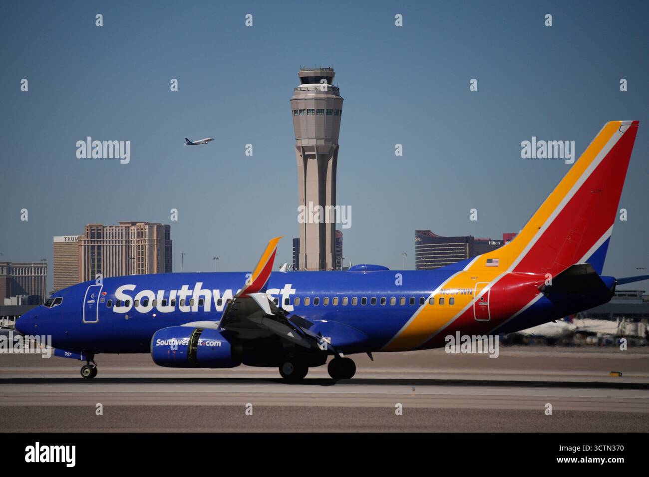 Planes land and take off at Harry Reid International Airport, Tuesday ...