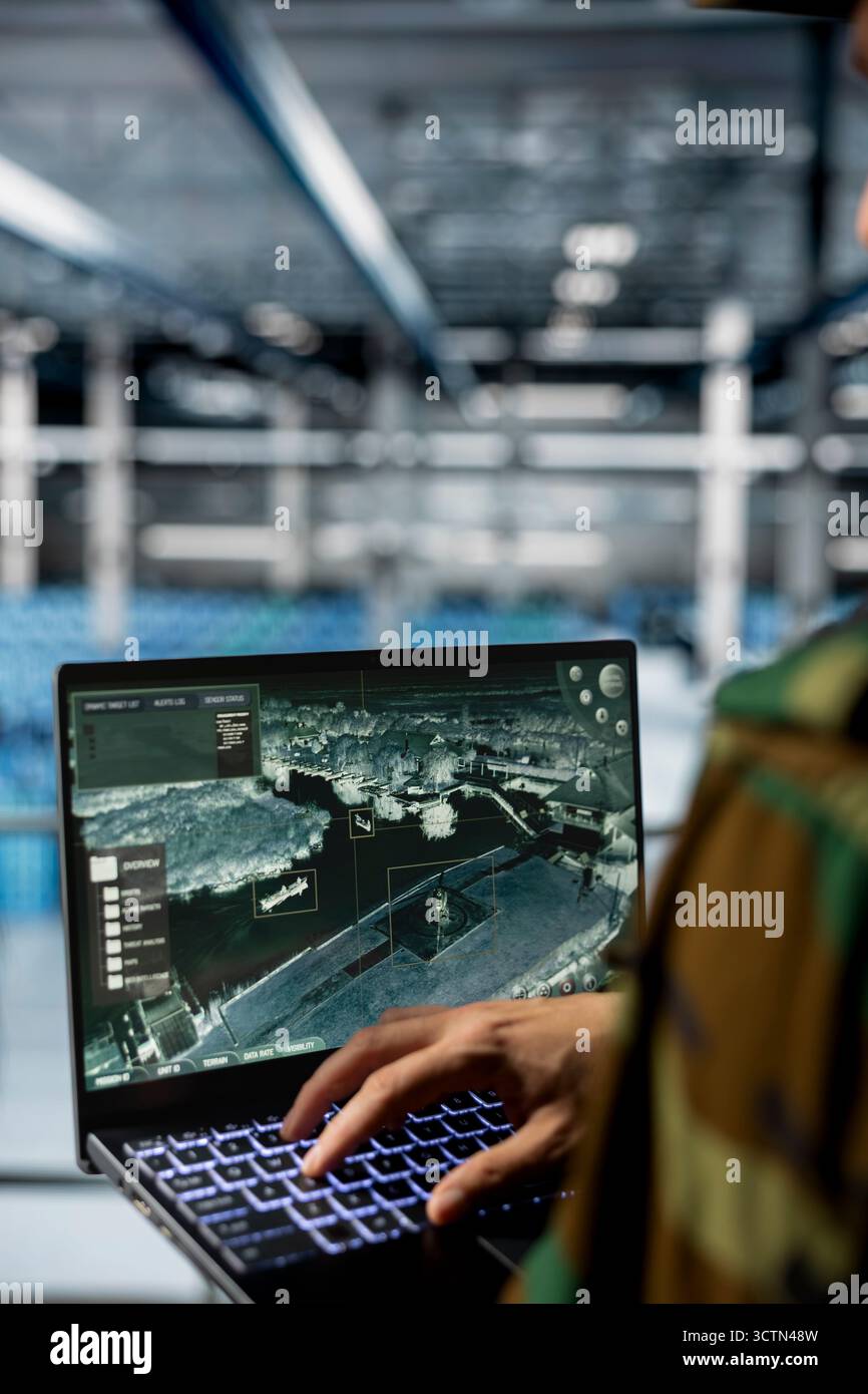 Close up of army expert in data center supporting mission operations ...