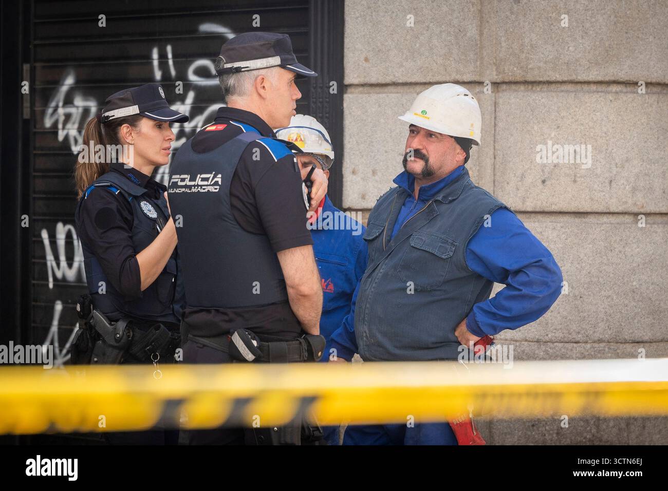 The police and the workers during the Building collapse in Madrid on 07 ...