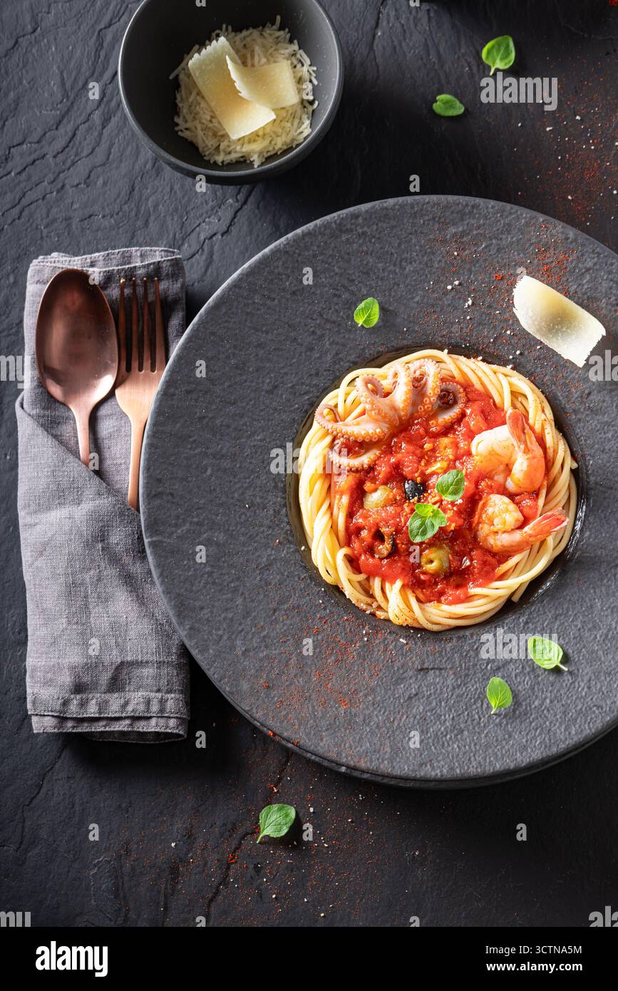 Elegant spaghetti bolognese decorated with herbs and parmesan ...
