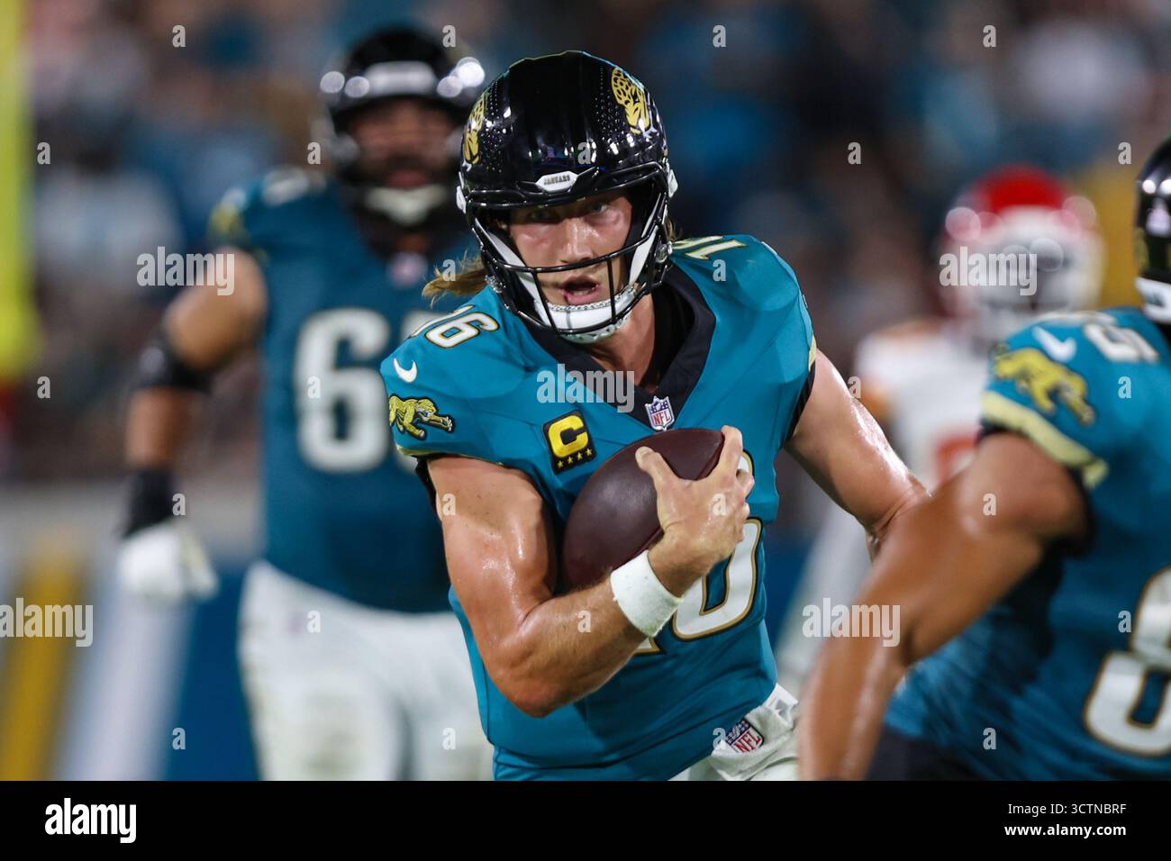 Jacksonville Jaguars quarterback Trevor Lawrence (16) runs the ball ...