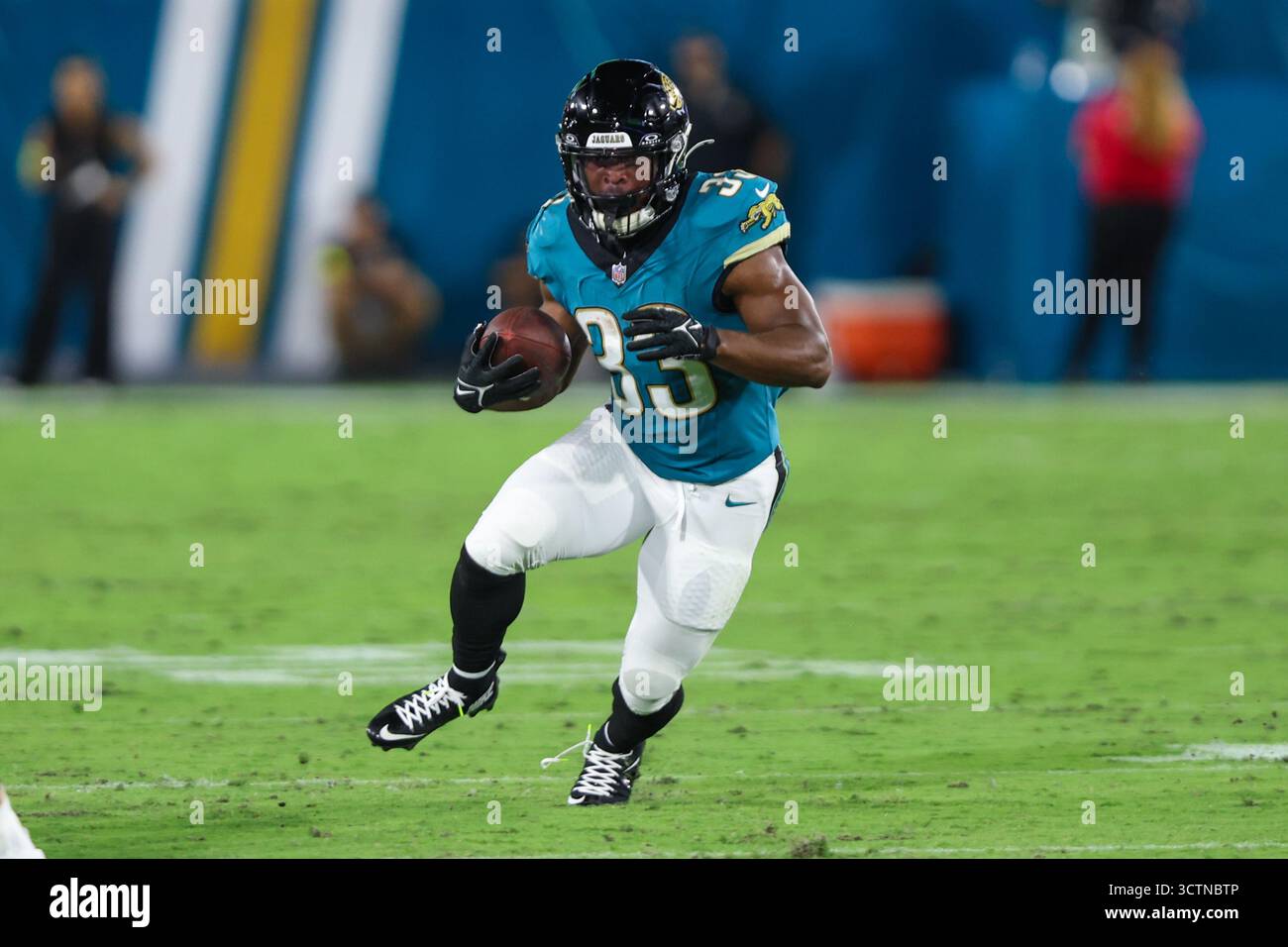 Jacksonville Jaguars running back Bhayshul Tuten (33) runs the ball ...