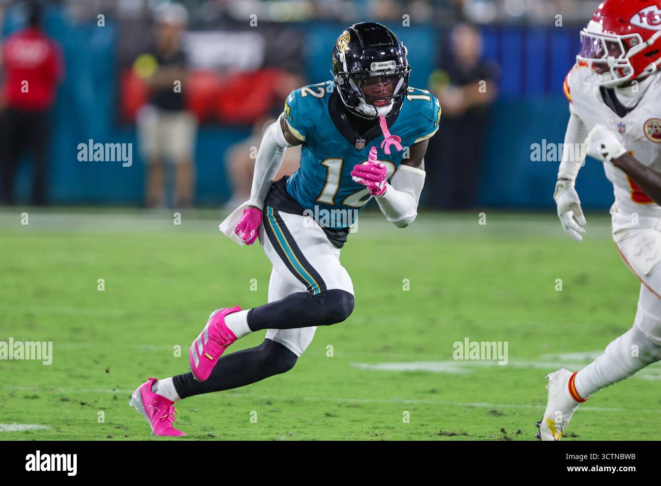 Jacksonville Jaguars' Travis Hunter (12) rus to the ball during an NFL ...