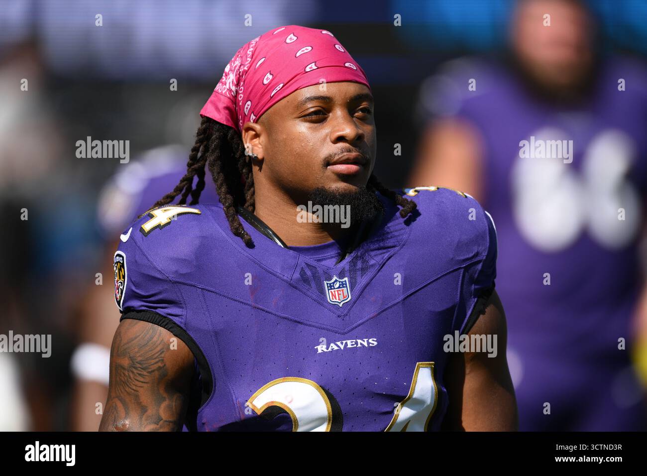 Baltimore Ravens running back Keaton Mitchell (34) warms up before an ...