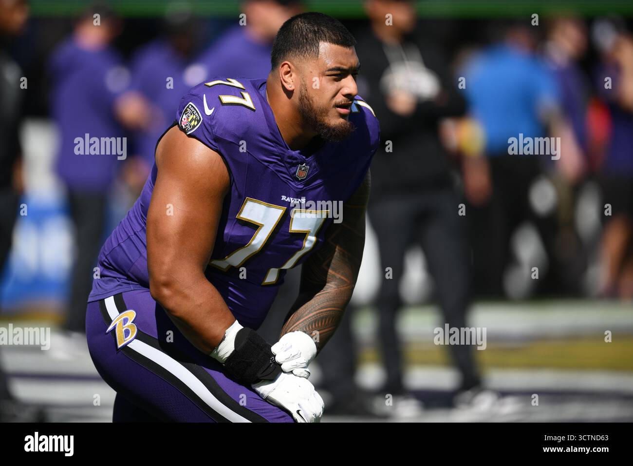 Baltimore Ravens guard Daniel Faalele (77) warms up before an NFL ...