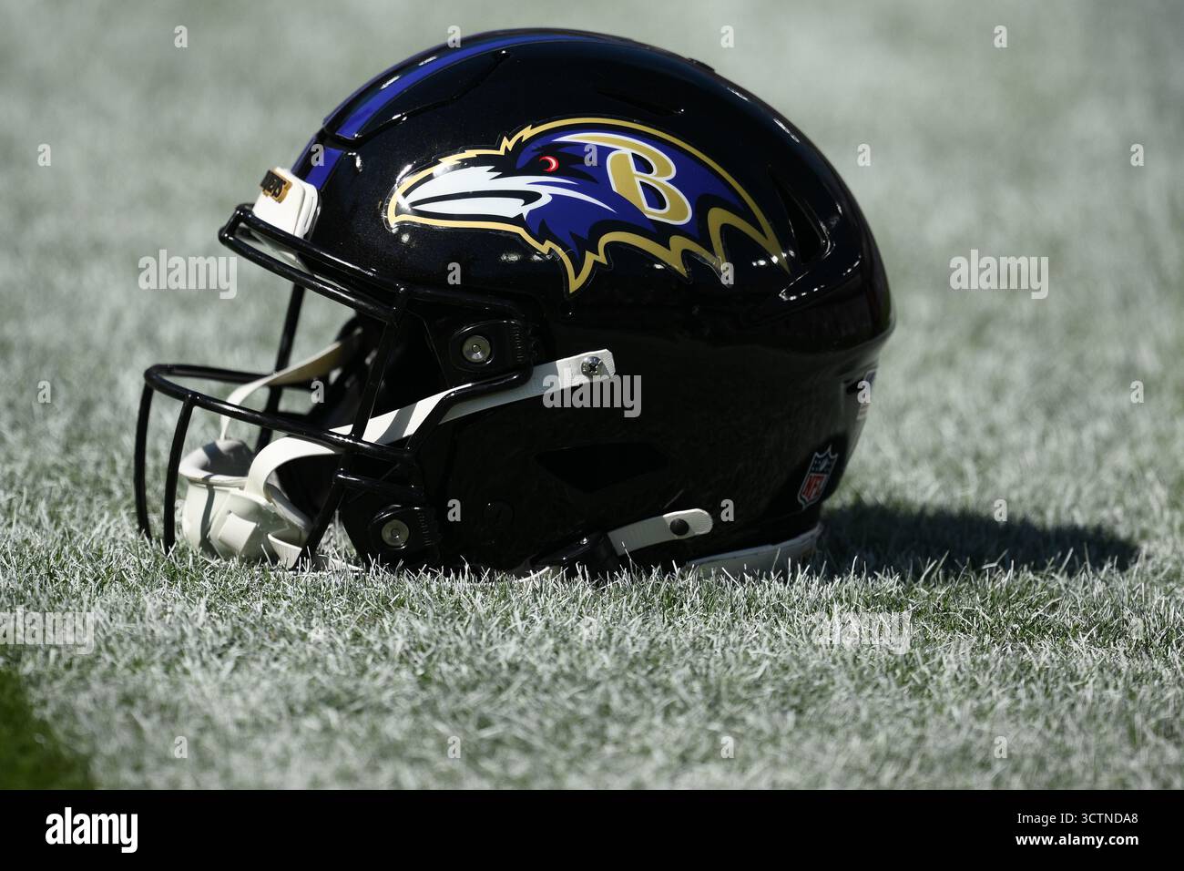 A Baltimore Ravens helmet lies on the field before an NFL football game ...