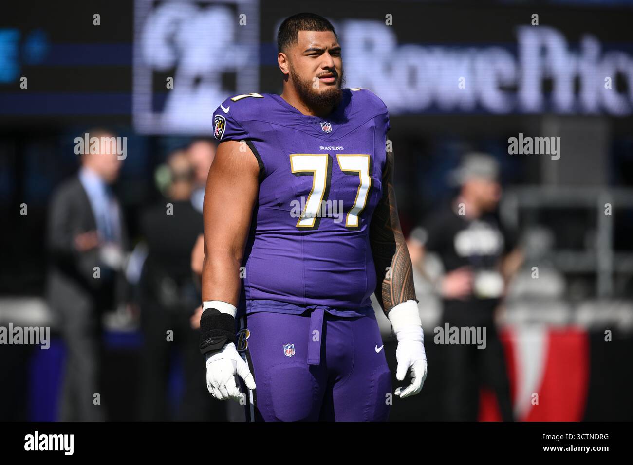 Baltimore Ravens guard Daniel Faalele (77) warms up before an NFL ...
