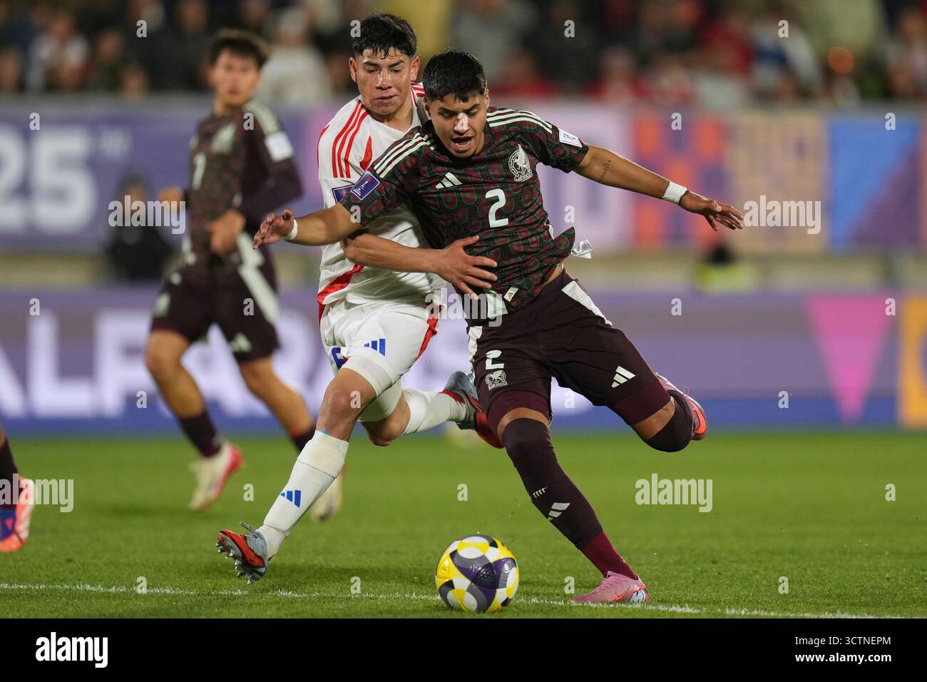 Mexico's Everardo Lopez (2) and Chile's Javier Carcamo battle for the ...