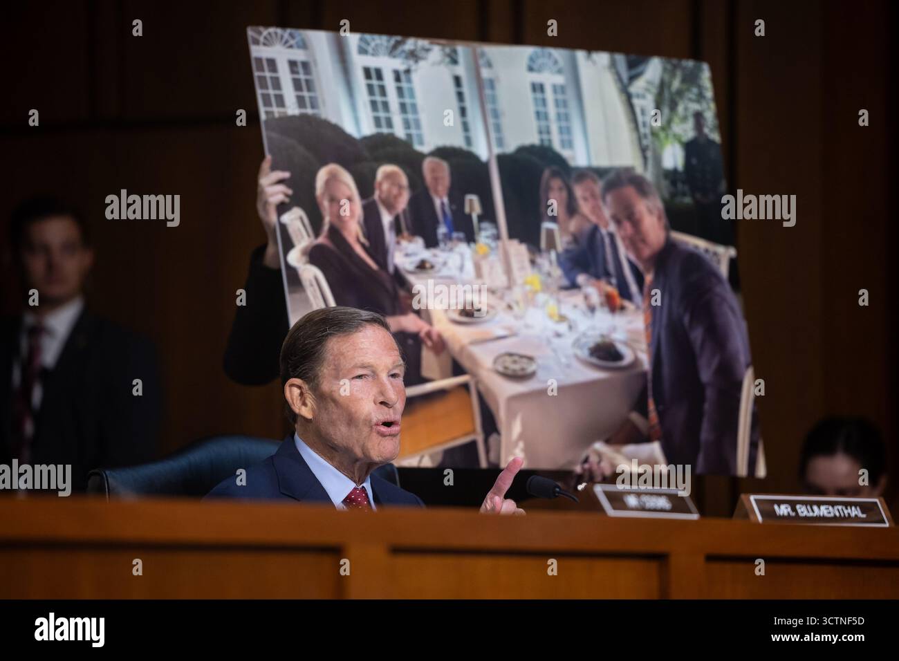 Sen. Richard Blumenthal (D-Conn.) displays a photo of Attorney General ...