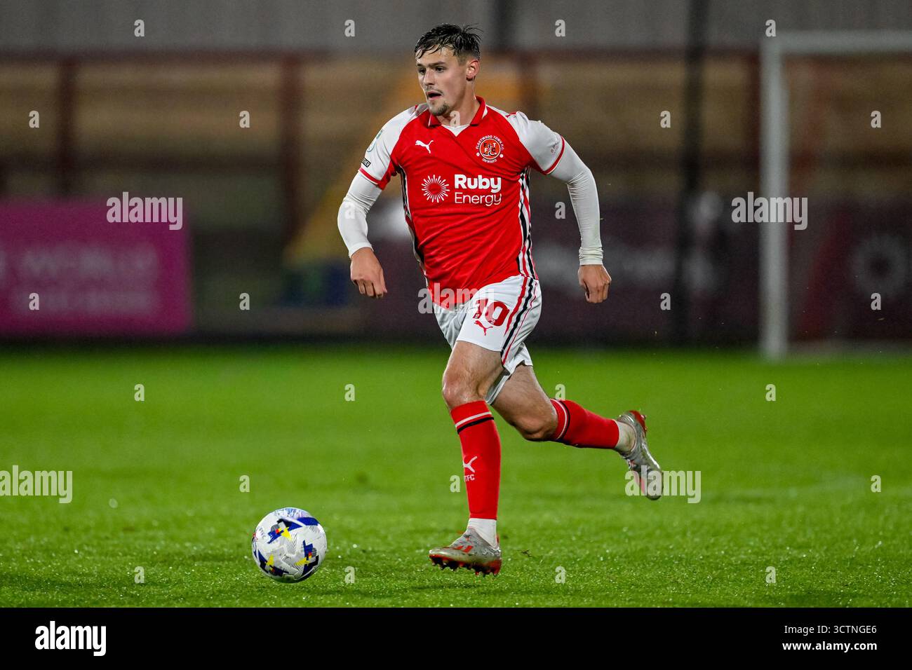 Mark Helm of Fleetwood Town with ball running during the The Vertu ...