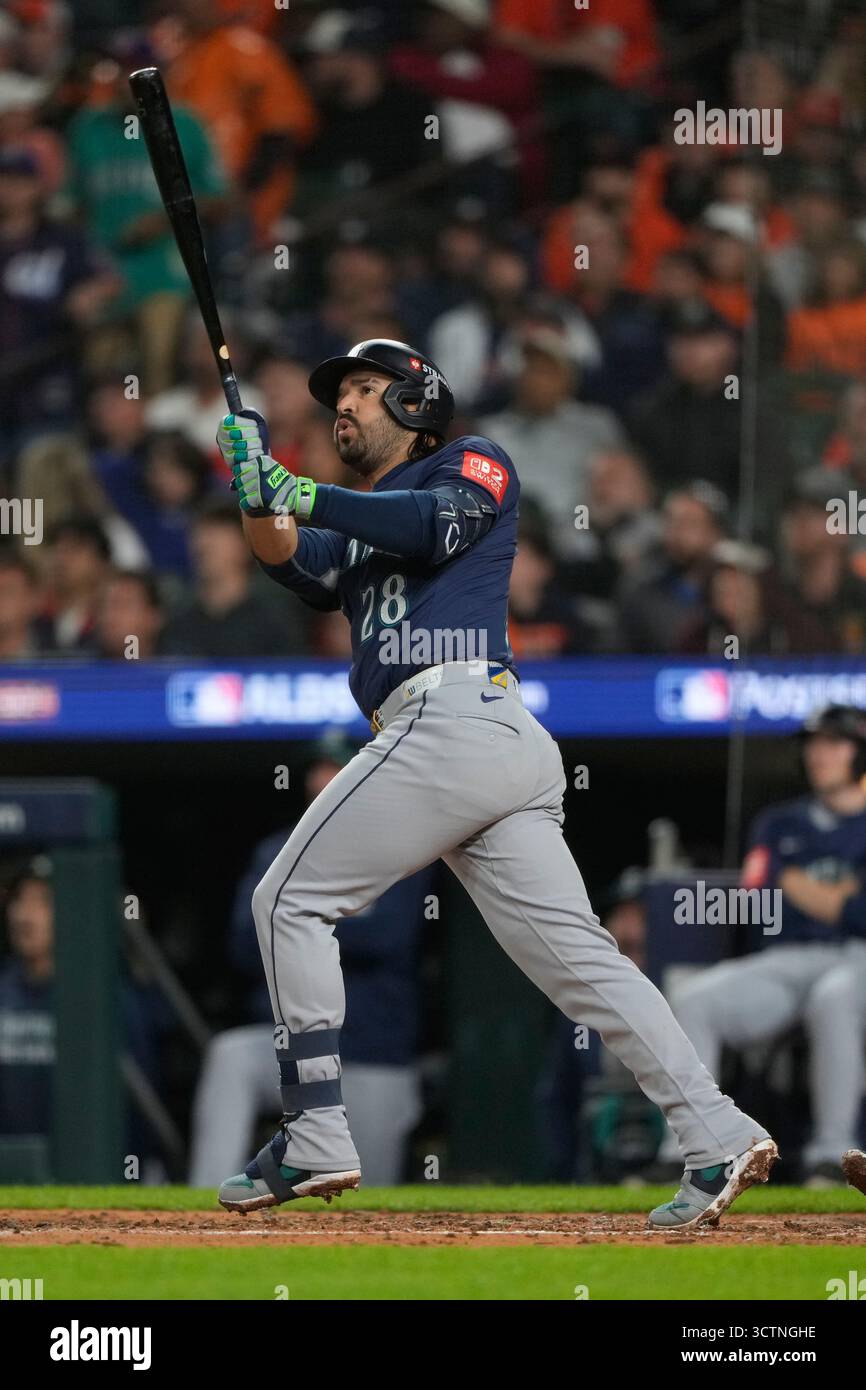 Seattle Mariners' Eugenio Suárez watches his solo home run during the ...