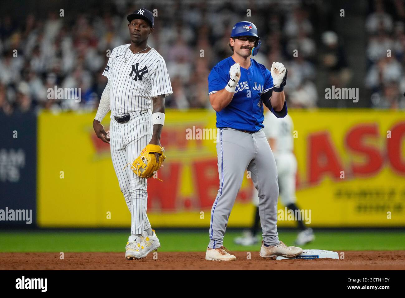Toronto Blue Jays Davis Schneider reacts after hitting a double against ...