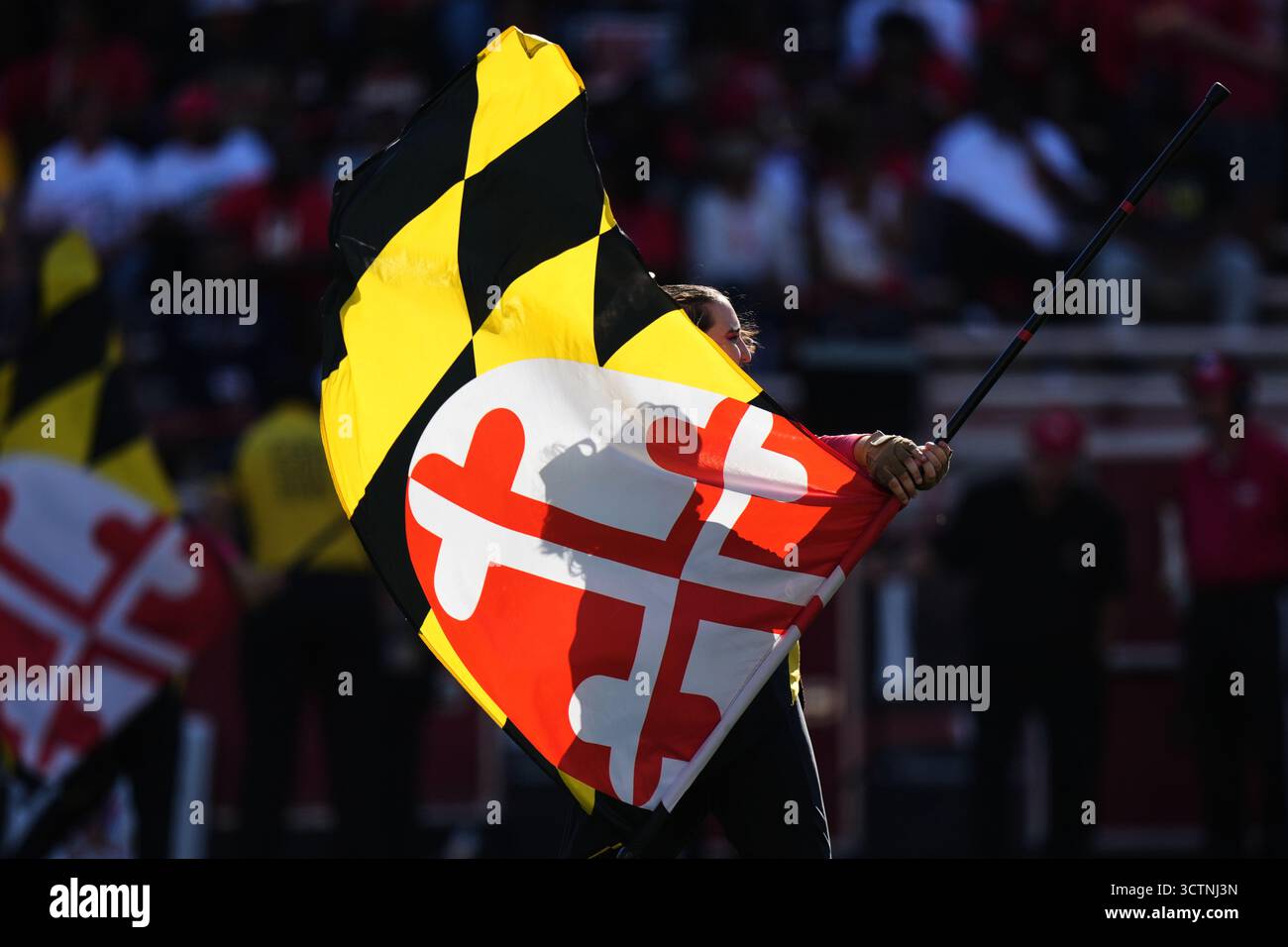 The University of Maryland color guard performs before an NCAA college ...