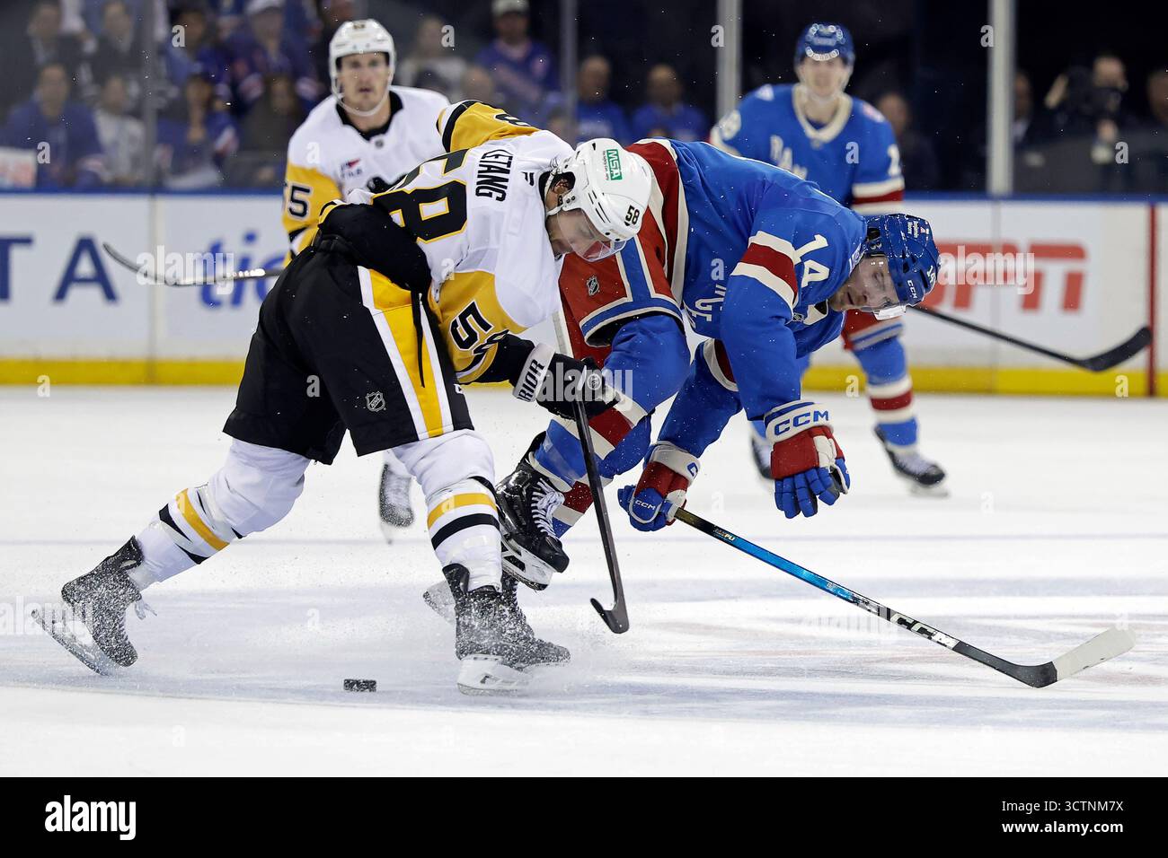 Pittsburgh Penguins defenseman Kris Letang (58) checks New York Rangers ...