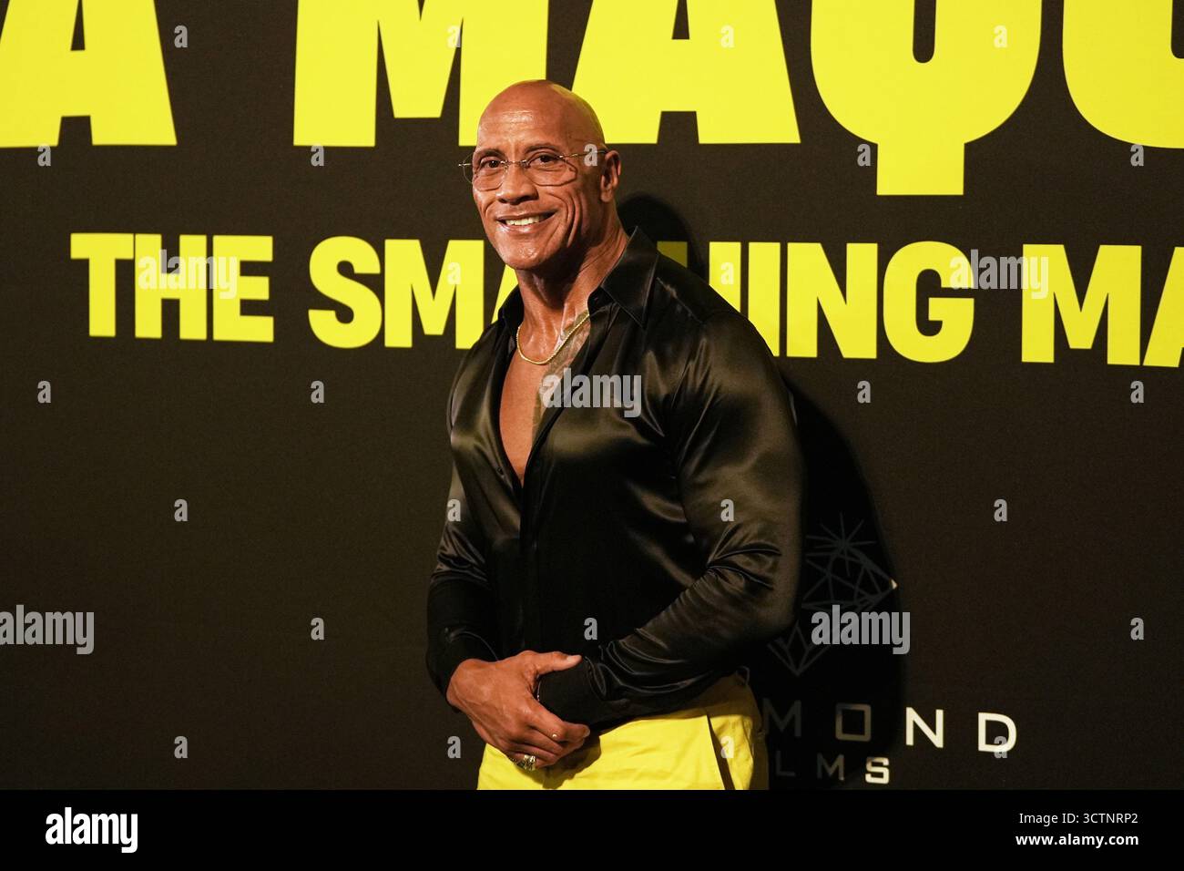 Actor Dwayne Johnson poses for photos during a red carpet event for the ...