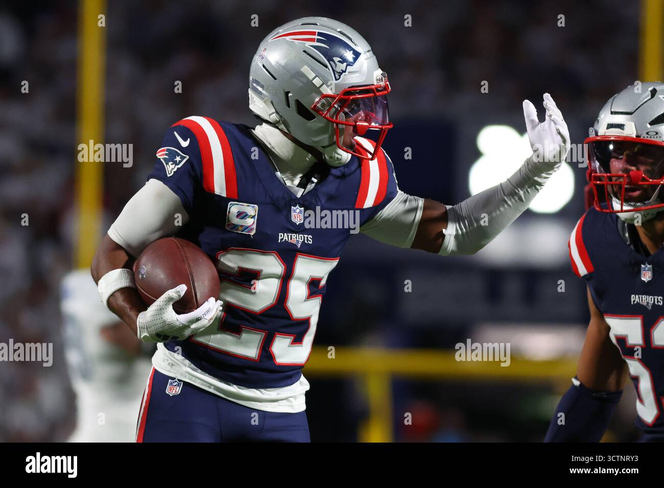 New England Patriots cornerback Marcus Jones (25) intercepts the ball ...