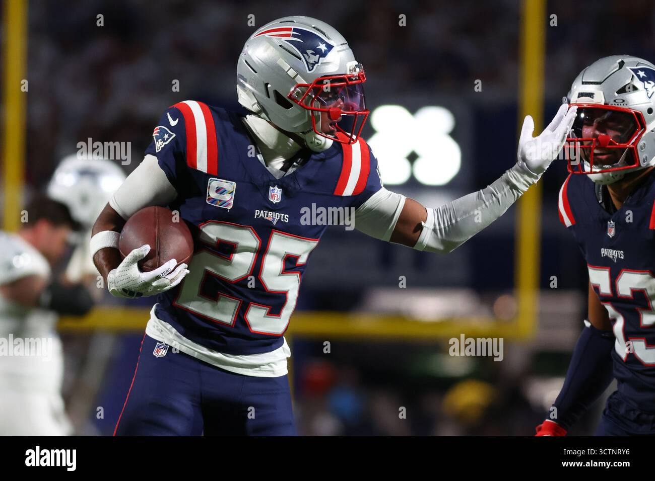 New England Patriots cornerback Marcus Jones (25) intercepts the ball ...