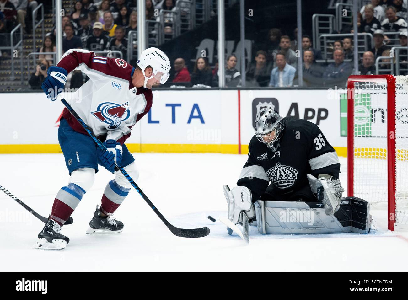 Los Angeles Kings goaltender Darcy Kuemper (35) blocks the shot by Colorado Avalanche center ...