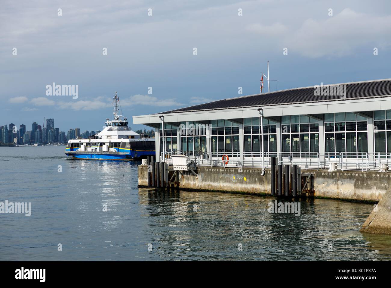 Vancouver, Canada - Sep25, 2025: Blue SeaBus ferry docking at modern ...