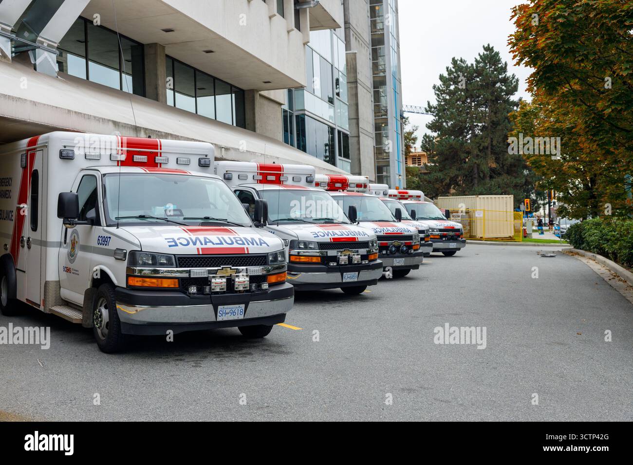 North Vancouver, Canada - Sep 25,2025: Row of white ambulances parked ...