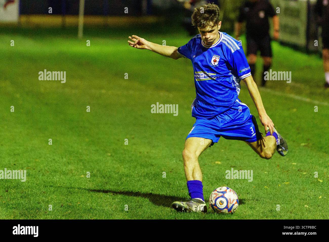 Aeron Bardsley of Glossop crosses the ball during Glossop North End AFC ...