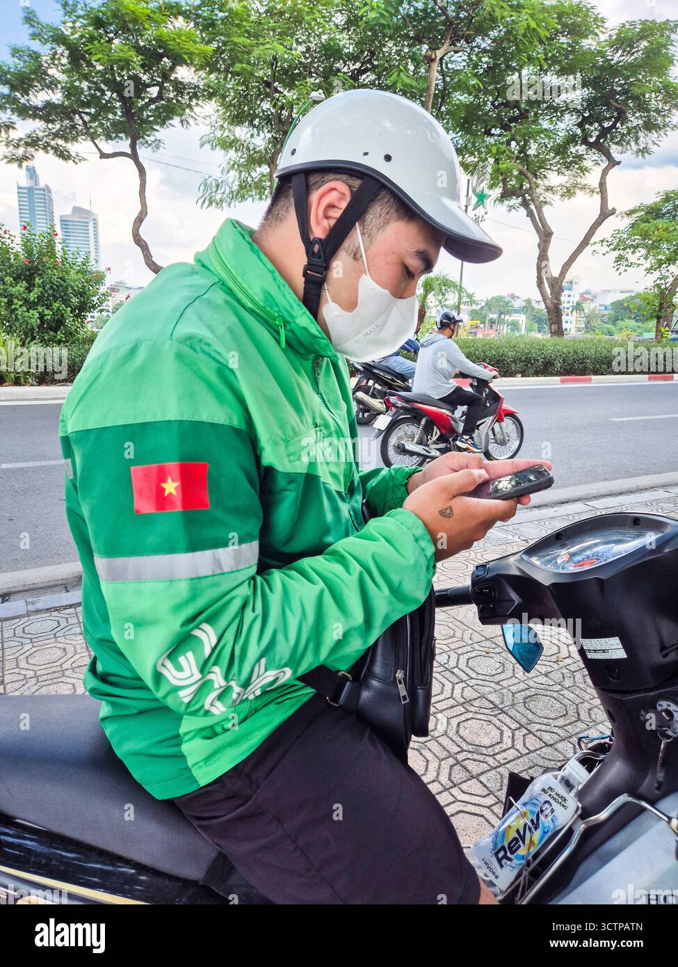 Grab motorcycle taxi hi-res stock photography and images - Alamy