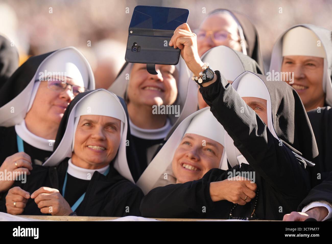 Nuns take a selfie as they attend the Pope Leo XIV holding his weekly ...