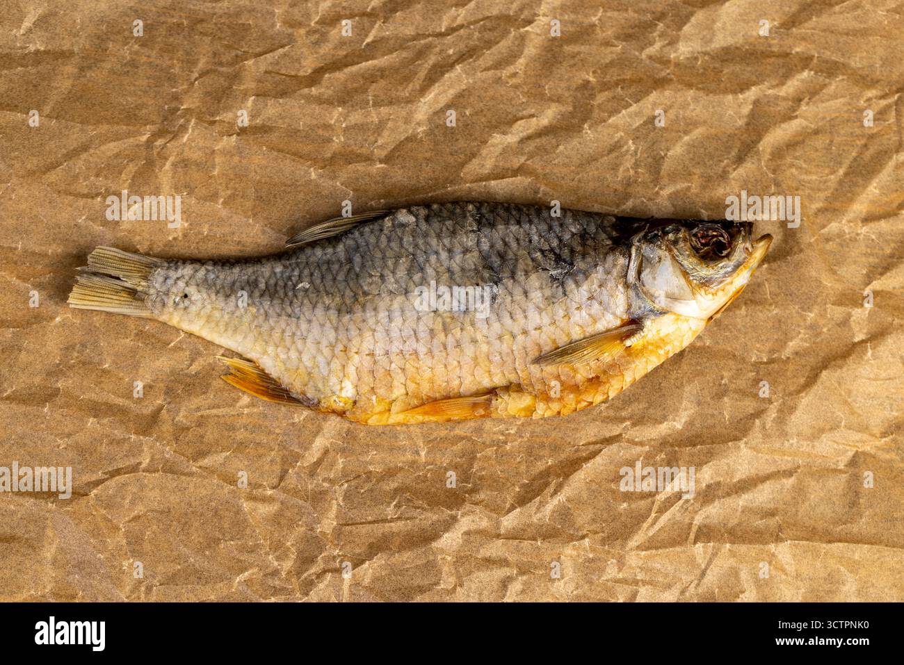 dried fish for long storage by dehydrating whole fish in the sun, semi ...