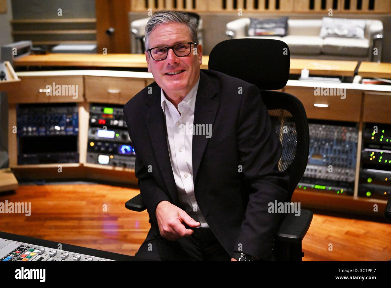 British Prime Minister Keir Starmer poses for photos in the studio ...