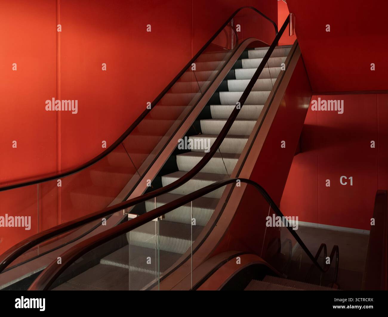 Modern Red Escalator with Minimalist Architecture and Geometric Design ...