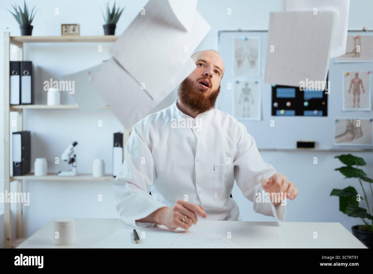 Irritated man throw document papers hi-res stock photography and images ...