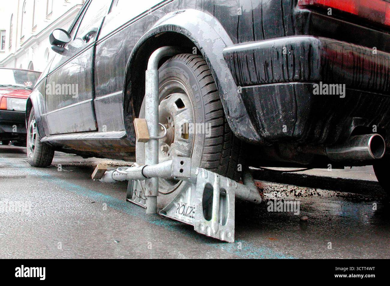 parking clamp on the tyre of a car for parking offence parking clamp on ...
