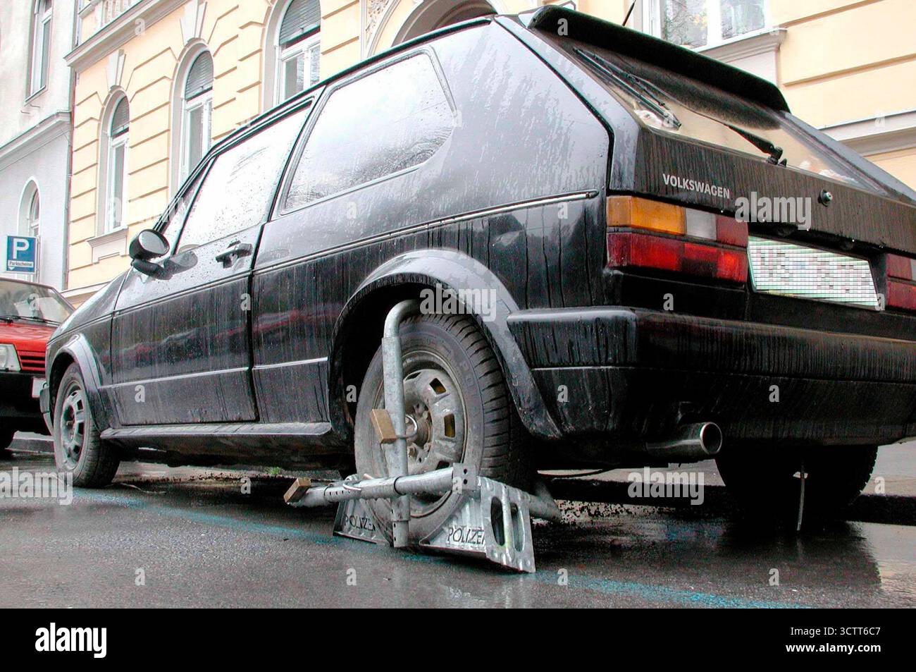 parking clamp on the tyre of a car for parking offence parking clamp on ...