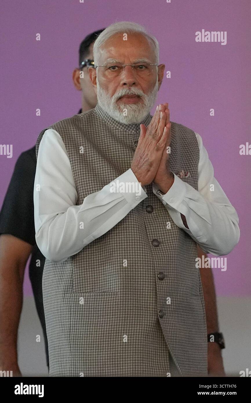 Indian Prime Minister Narendra Modi greets during the inauguration ...