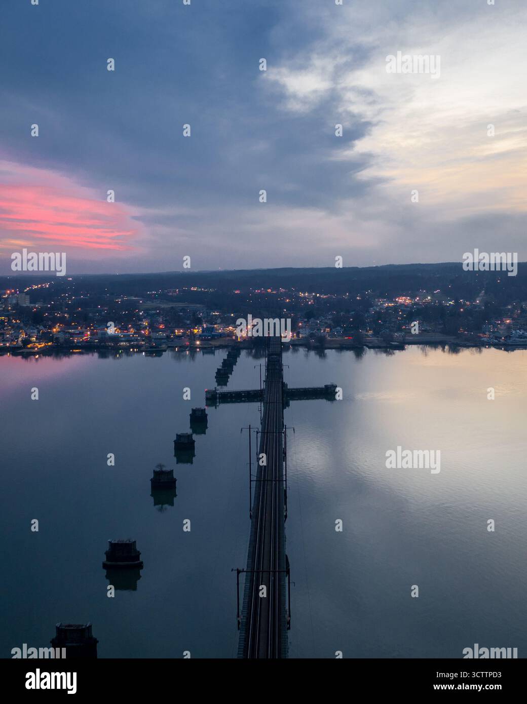 Aerial view of a bridge stretching across the tranquil water ...
