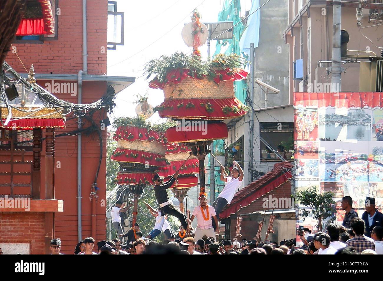 Kathmandu, Nepal. 8th Oct, 2025. Local people rotate the traditional ...