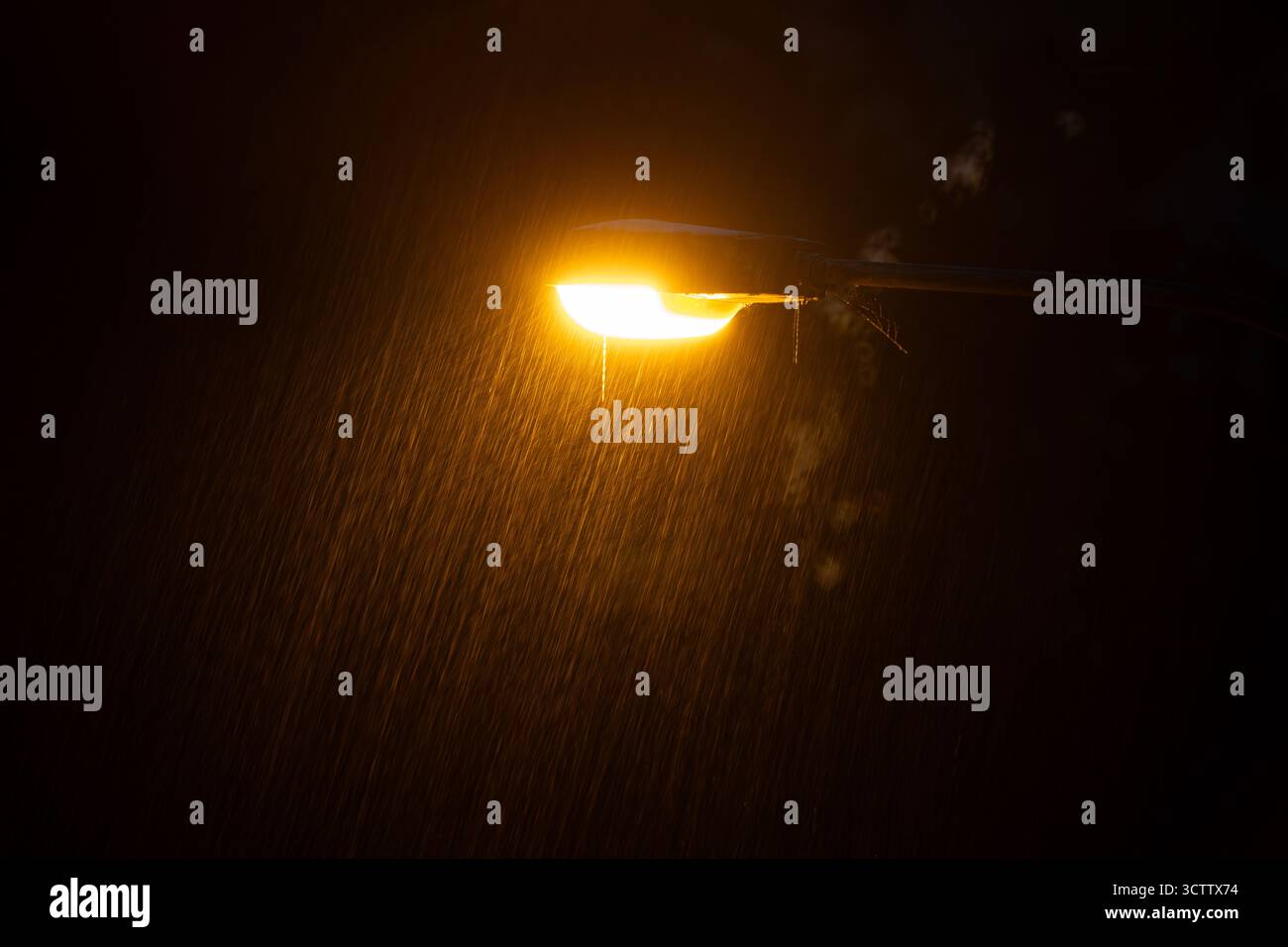 Raindrops falling night illuminated bright hi-res stock photography and ...