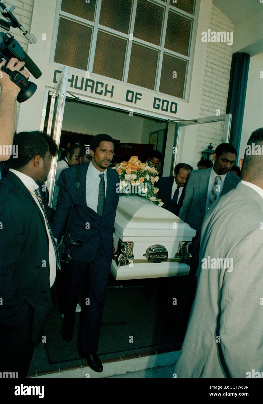 Pallbearers carry the casket of Clement Anthony Lloyd following funeral ...