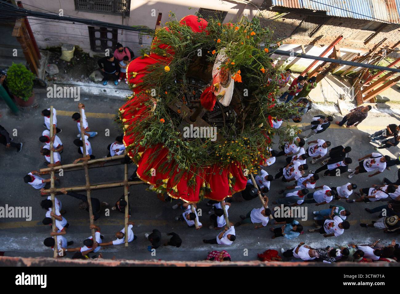 Kathmandu, Nepal. 8 October 2025. Locals spin the traditional upside ...