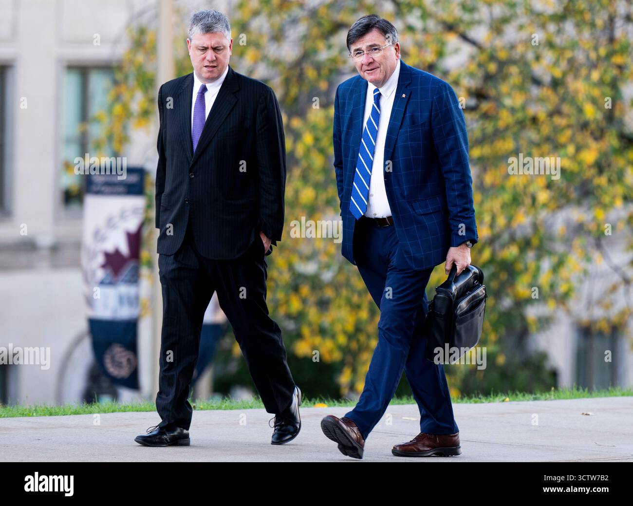 Conservative MP Costas Menegakis, right, arrives on Parliament Hill ...