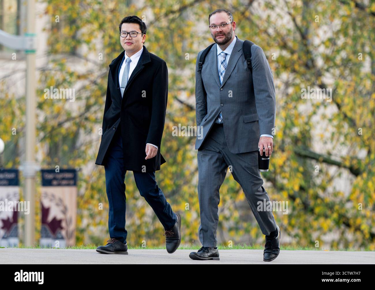 Conservative MP Vincent Neil Ho, left, and Conservative MP Warren ...