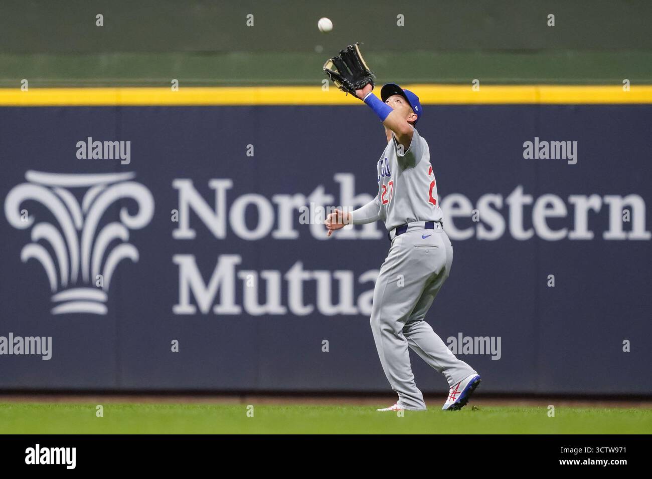 Chicago Cubs right fielder Seiya Suzuki catches a fly ball hit by ...