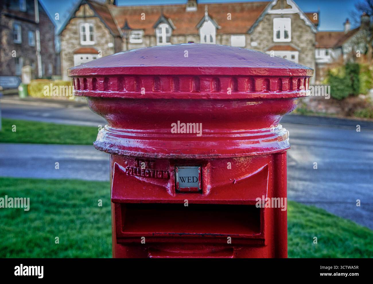 Letterbox on the street in an English village Stock Photo - Alamy