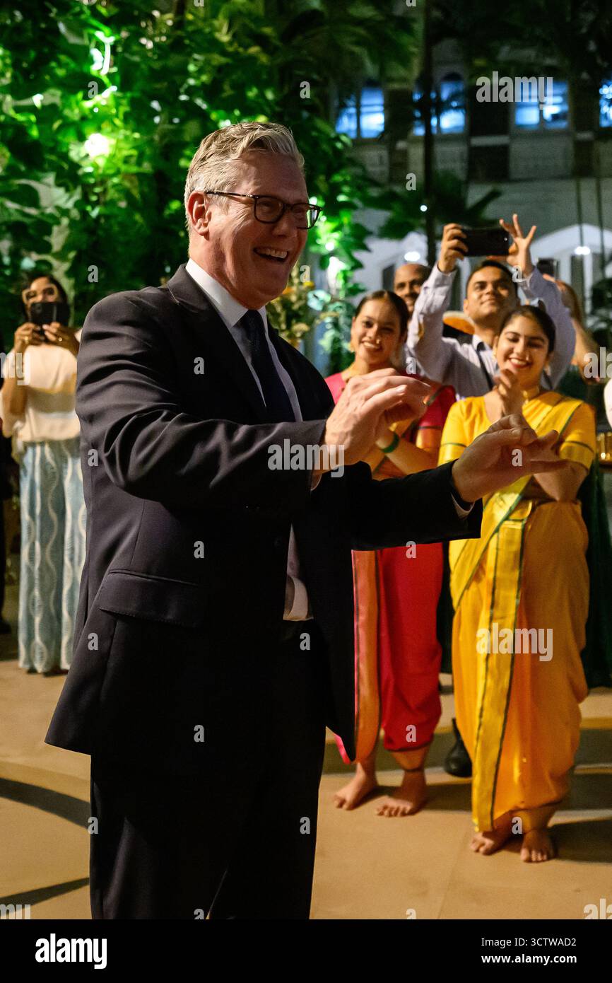 Prime Minister Sir Keir Starmer performs traditional dance hand ...