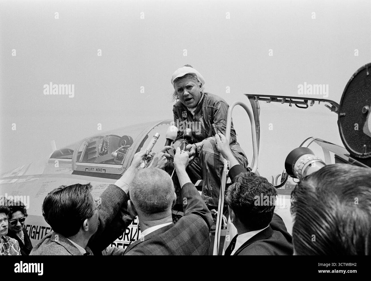 Jacqueline Cochran talks to newsmen from the cockpit of a Lockheed ...